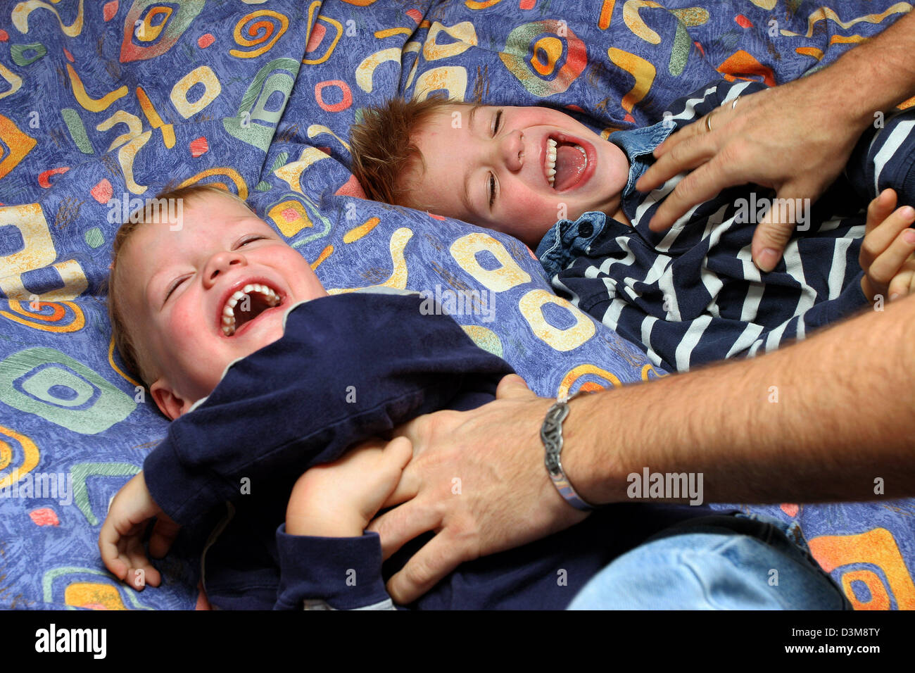Being tickled hi-res stock photography and images - Alamy