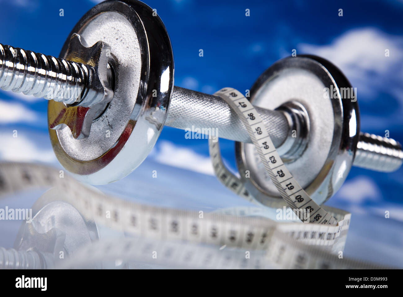Measuring of dumbbell Stock Photo - Alamy