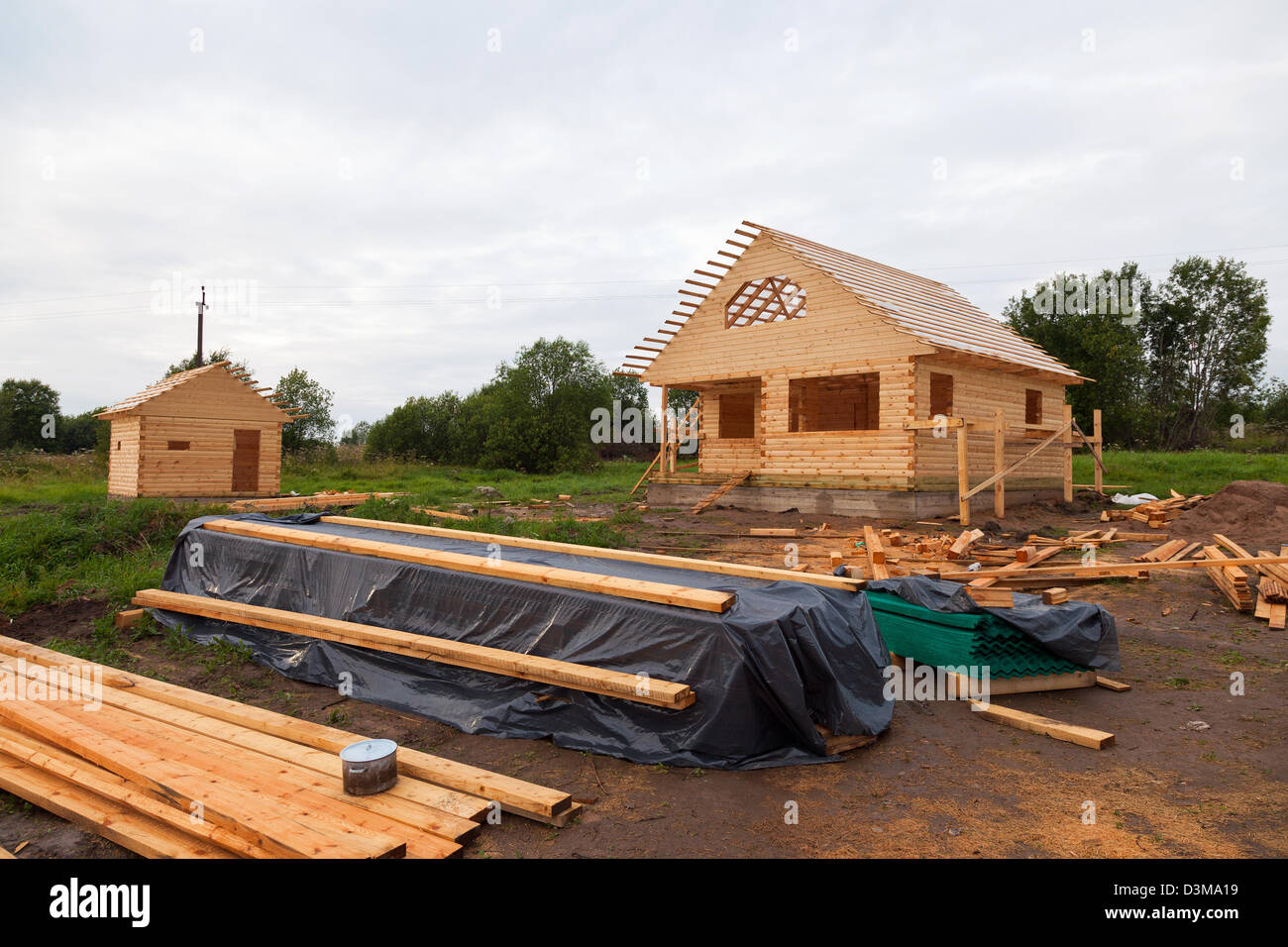 Wooden house under construction Stock Photo - Alamy