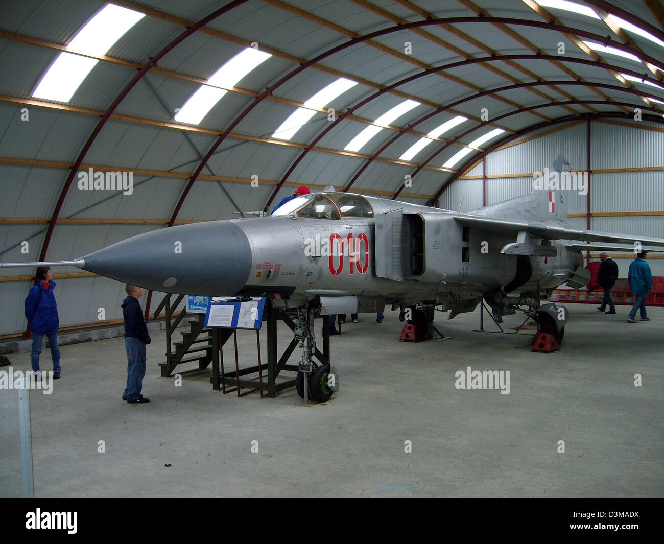 (dpa) - Visitors examine an exhibited fighter jet of the type MIG-23 of ...