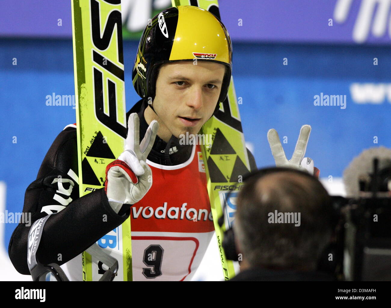 (dpa) - Germany's ski jumper Alexander Herr gestures two victory signs ...