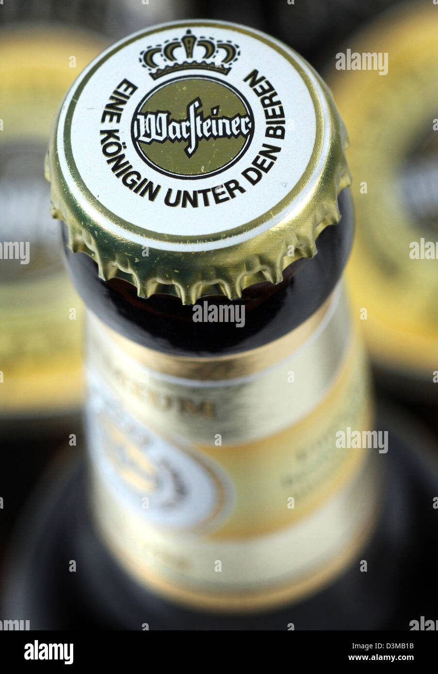 (dpa) - The picture shows bottles of the German beer brand Warsteiner ...