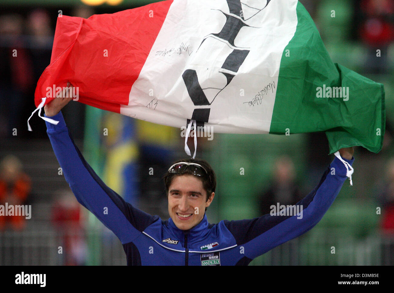 (dpa) - Italian speed skater Enrico Fabris celebrates his victory as ...
