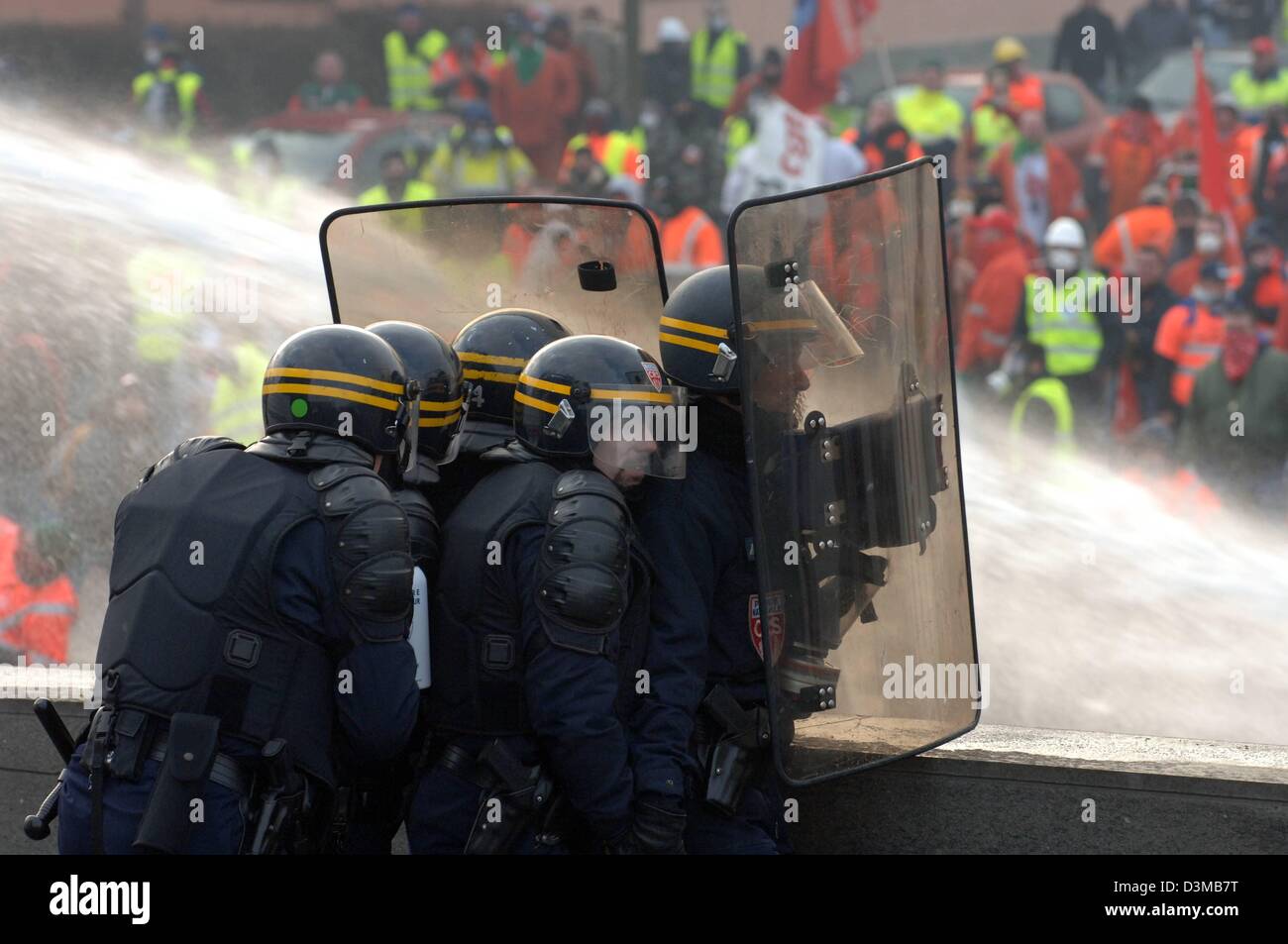Police officers protect the European Parliament against violent ...
