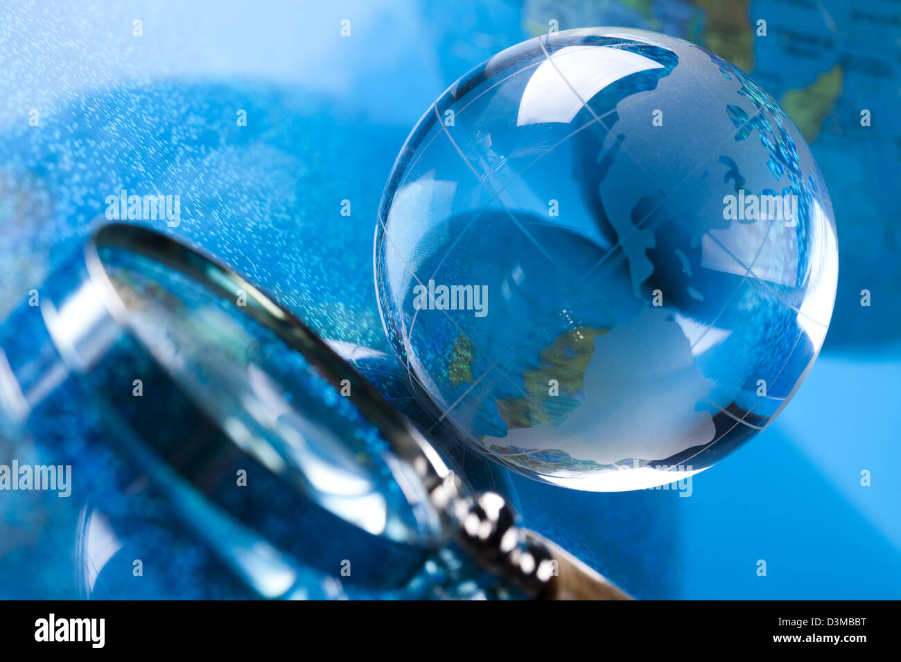 Globe and Magnifying glass Stock Photo - Alamy