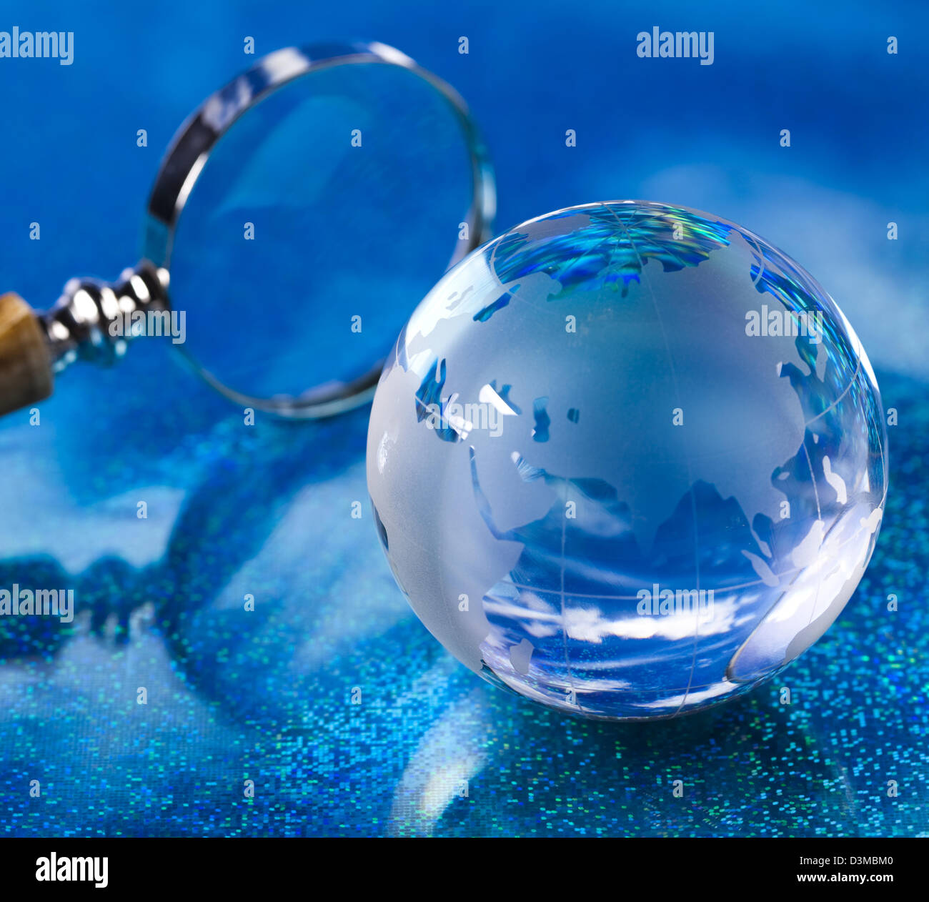 Globe and Magnifying glass Stock Photo - Alamy
