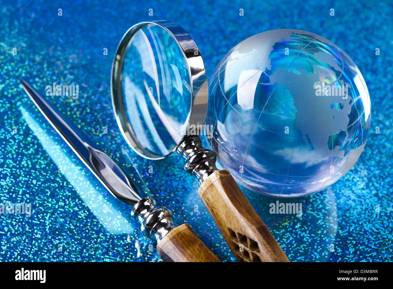 Globe and Magnifying glass Stock Photo - Alamy
