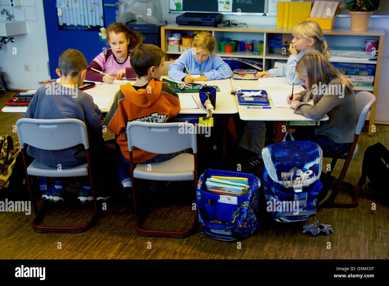 (FILE) Pupils calculate on a group table during the third grade maths ...