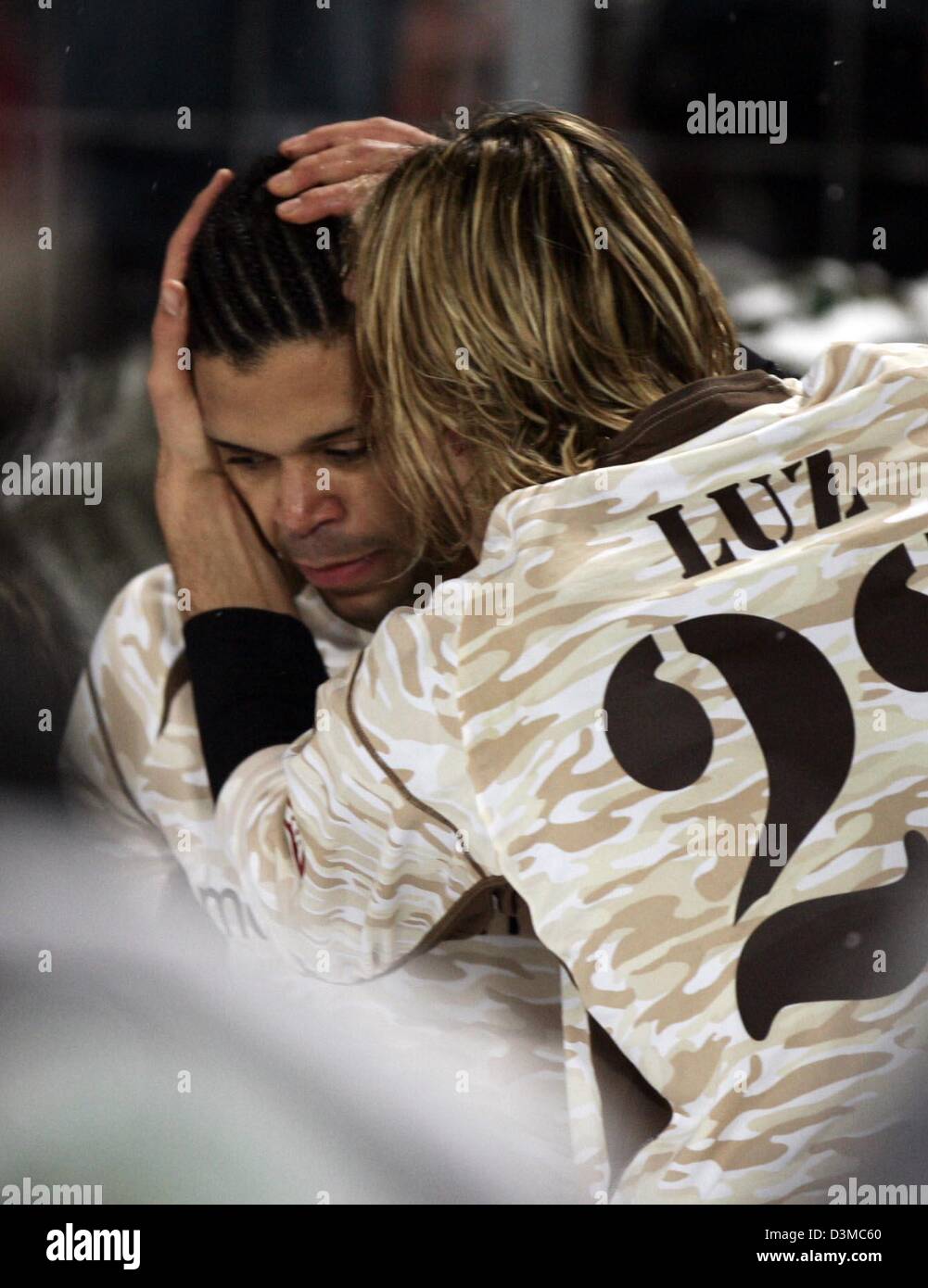Michel Mazingu-Dinzey (L) celebrates together with his teammate Felix ...