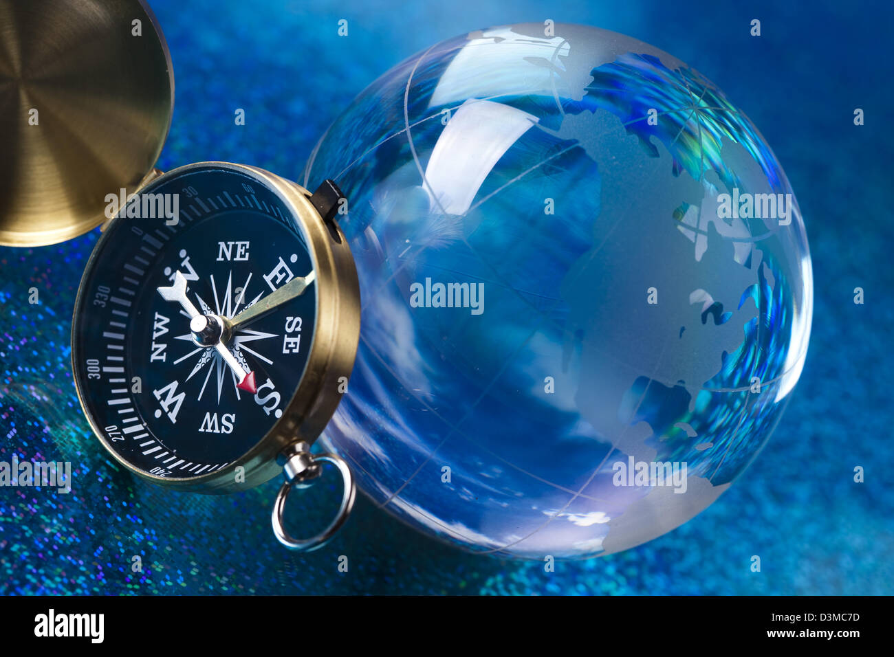 Magnifying glass, Compass and globe Stock Photo - Alamy