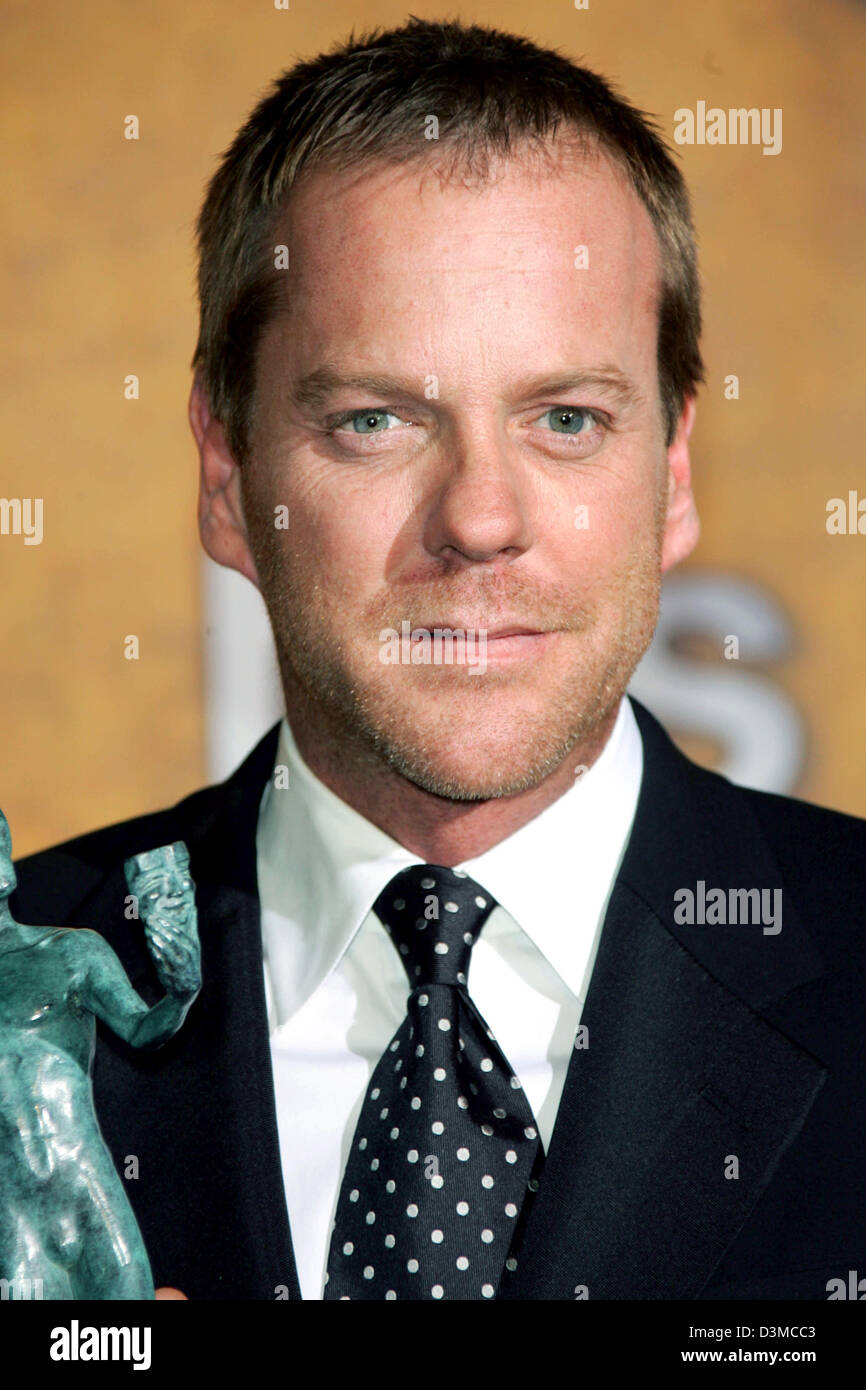 Kiefer Sutherland poses with the award for outstanding performance by a ...