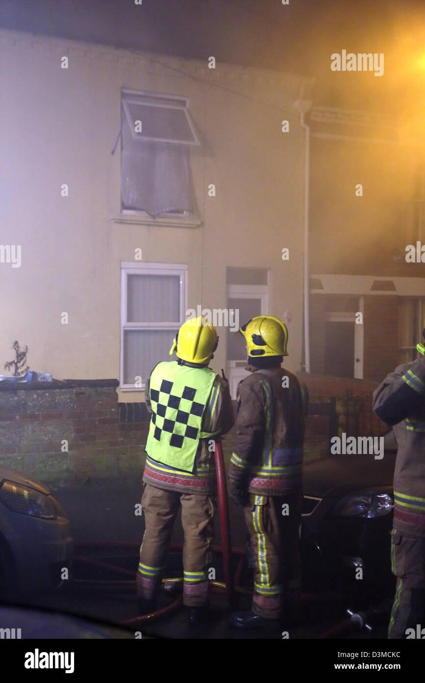 Firemen extinguishing a fire in a house in Norwich, England, UK Stock ...