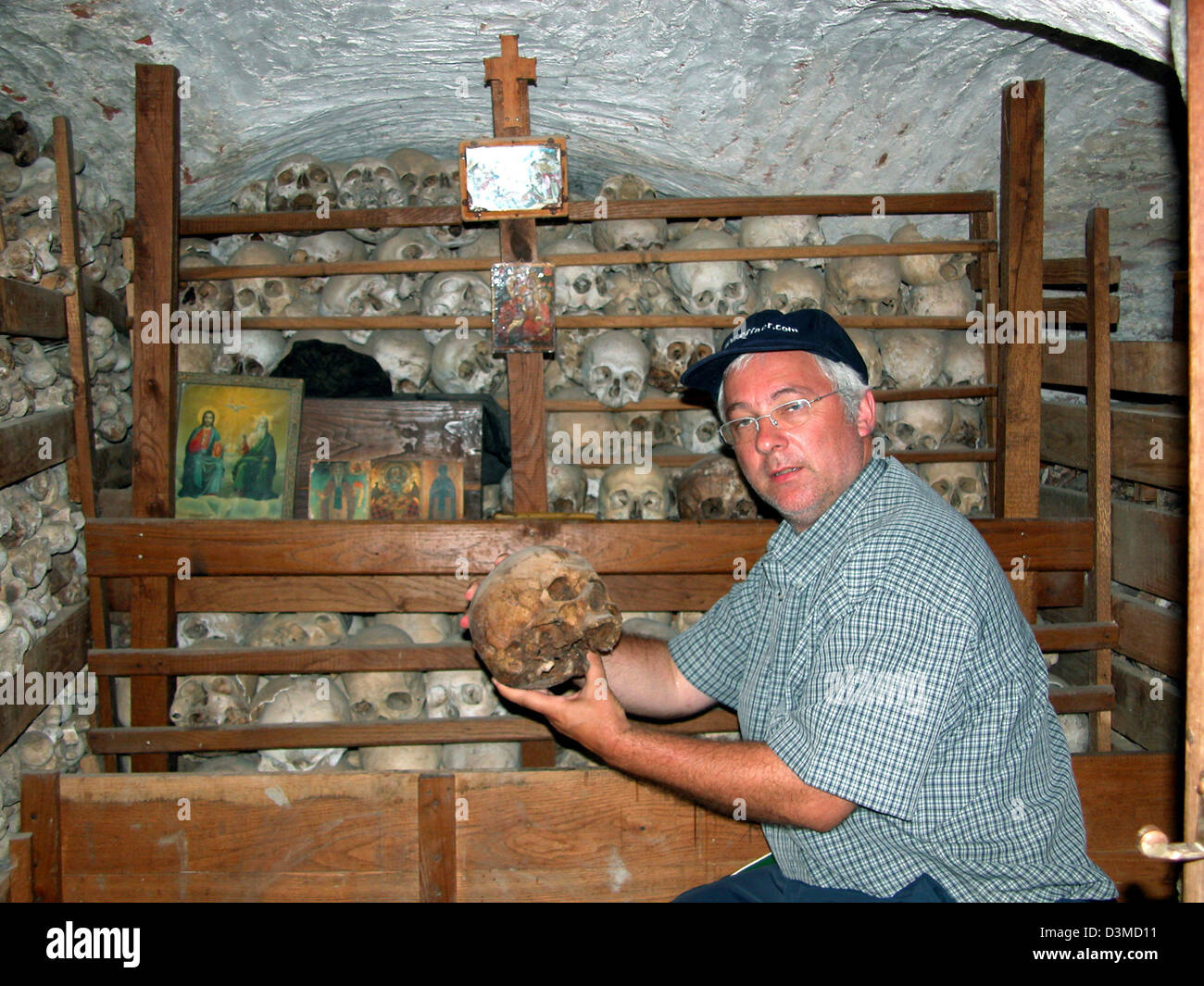 Skulls and icons are pictured in the ossuary of a monastery on the ...