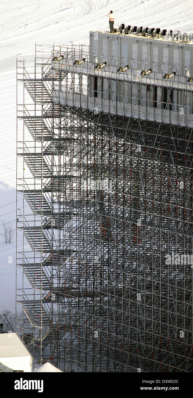 A man stands on the giant spectator stand for the 2006 Winter Olympics ...