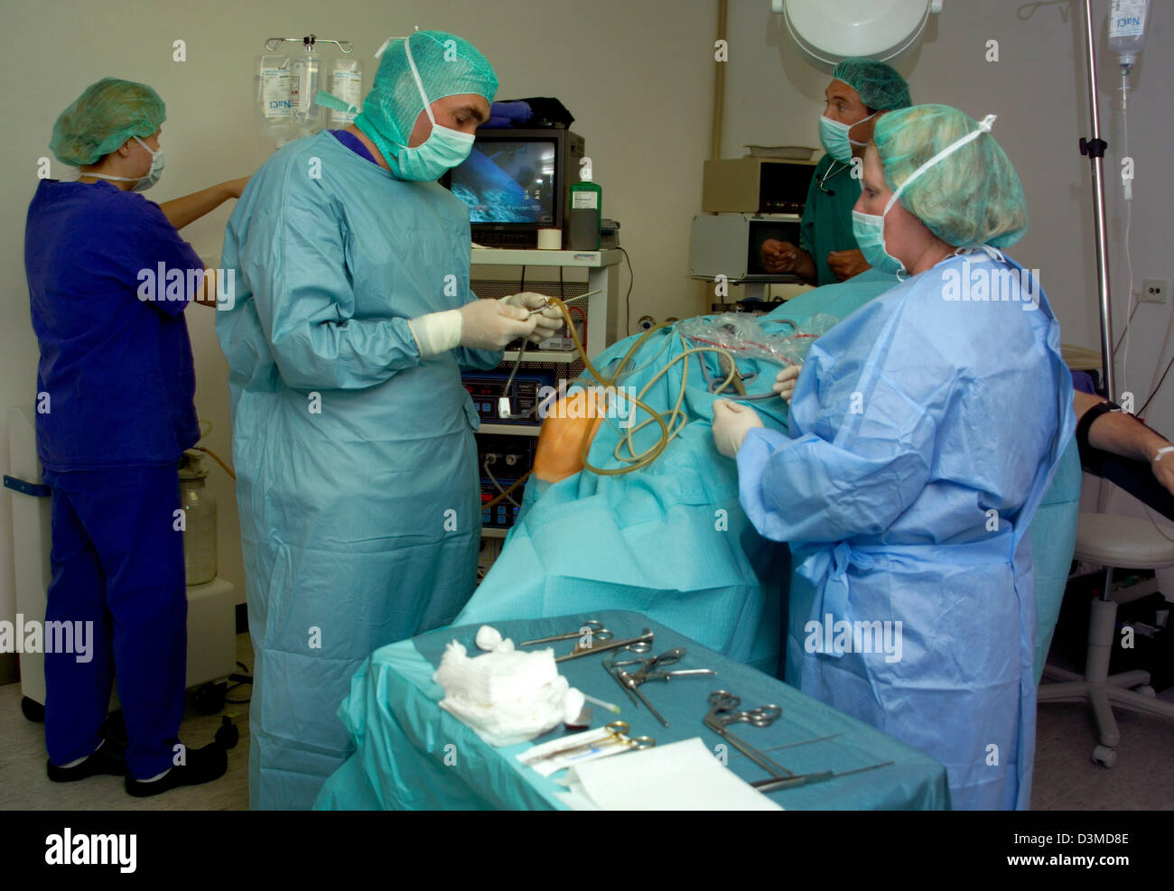 (FILE) An orthopaedist and his team prepare a patient for his ...