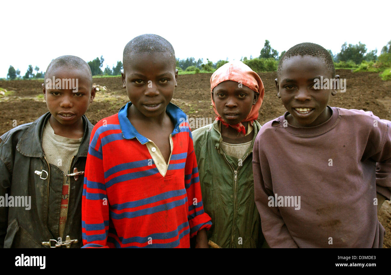 The picture shows four boys near the vulcano-national park in Rwanda ...