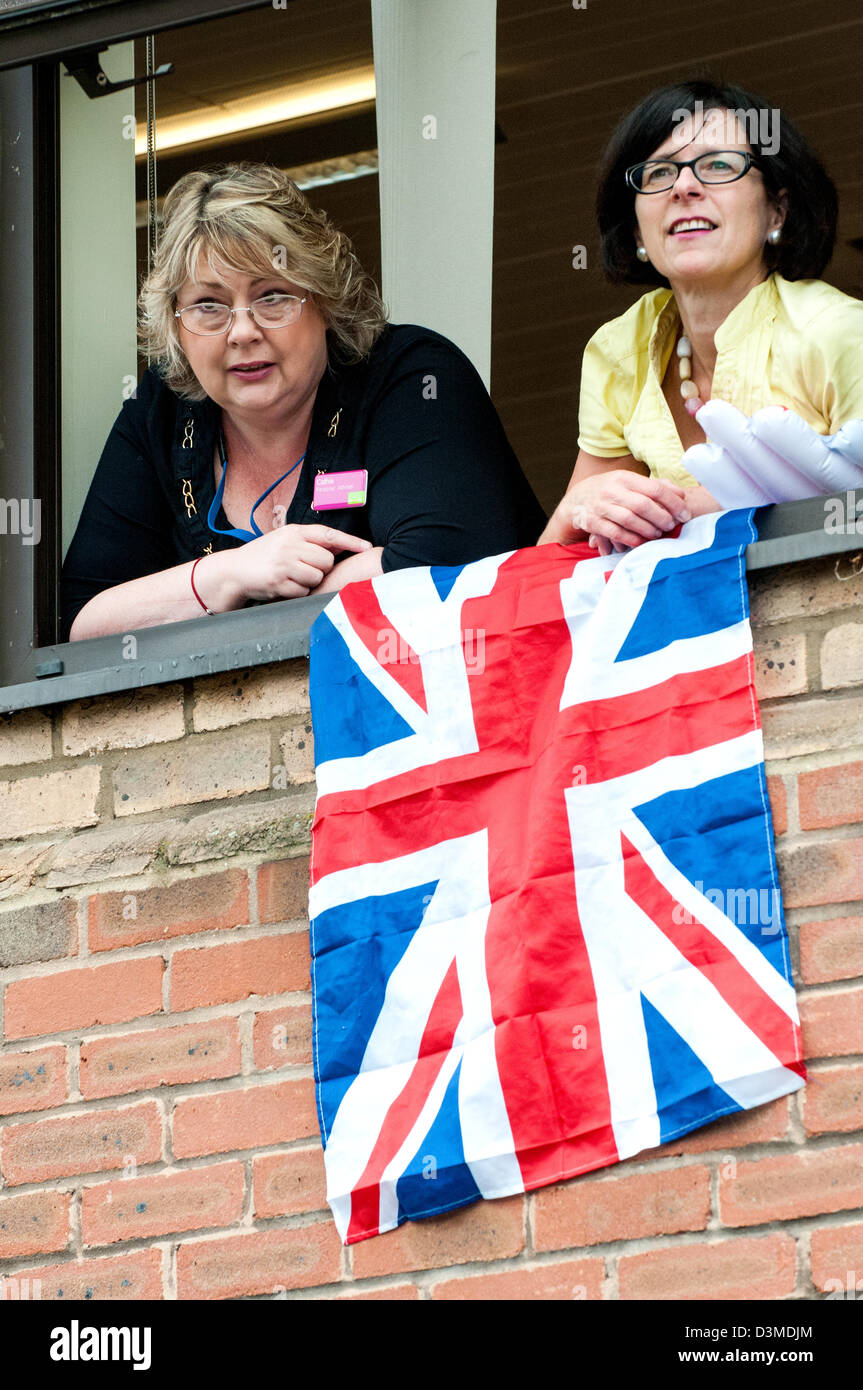 Two women spectators celebrating team GB and the Olympic torch Stock ...