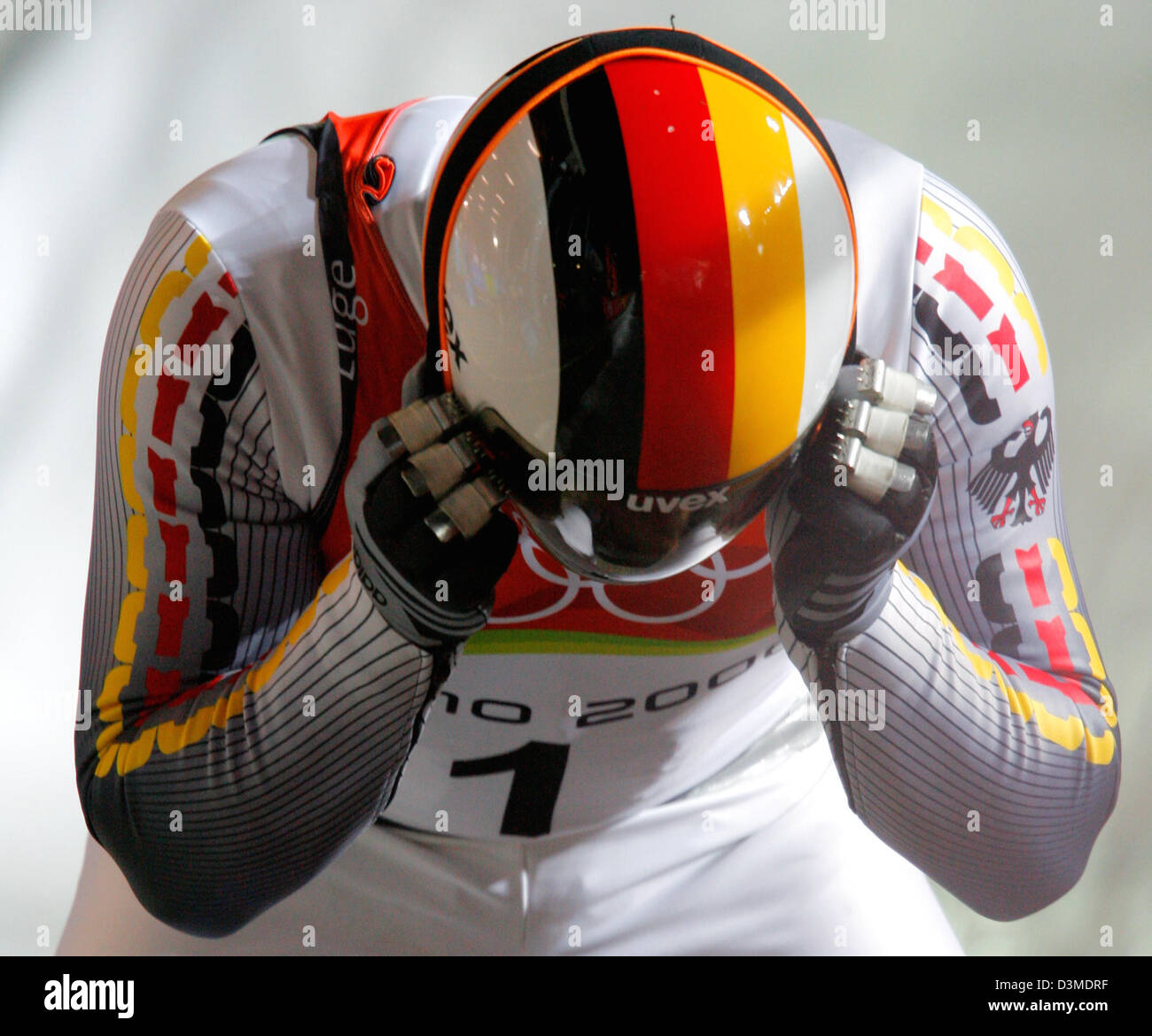 German triple gold medal winner Georg Hackl takes of his helmet after ...