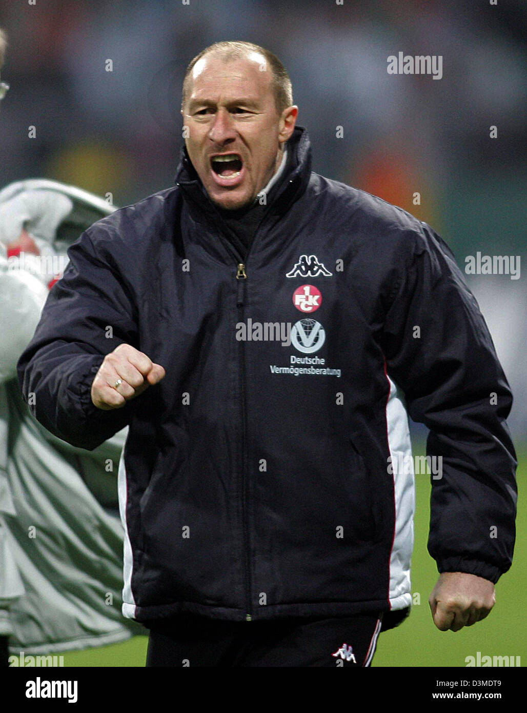 Kaiserslautern's soccer coach Wolfgang Wolf celebrates after his team ...