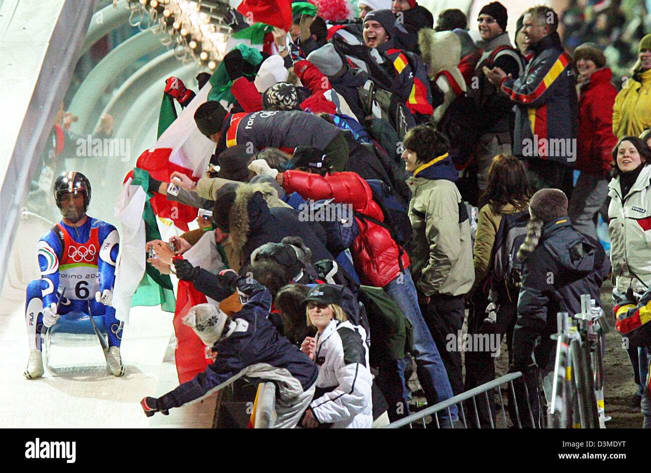 Italian fans cheer for Italian luger Armin Zoeggler after his fourth ...