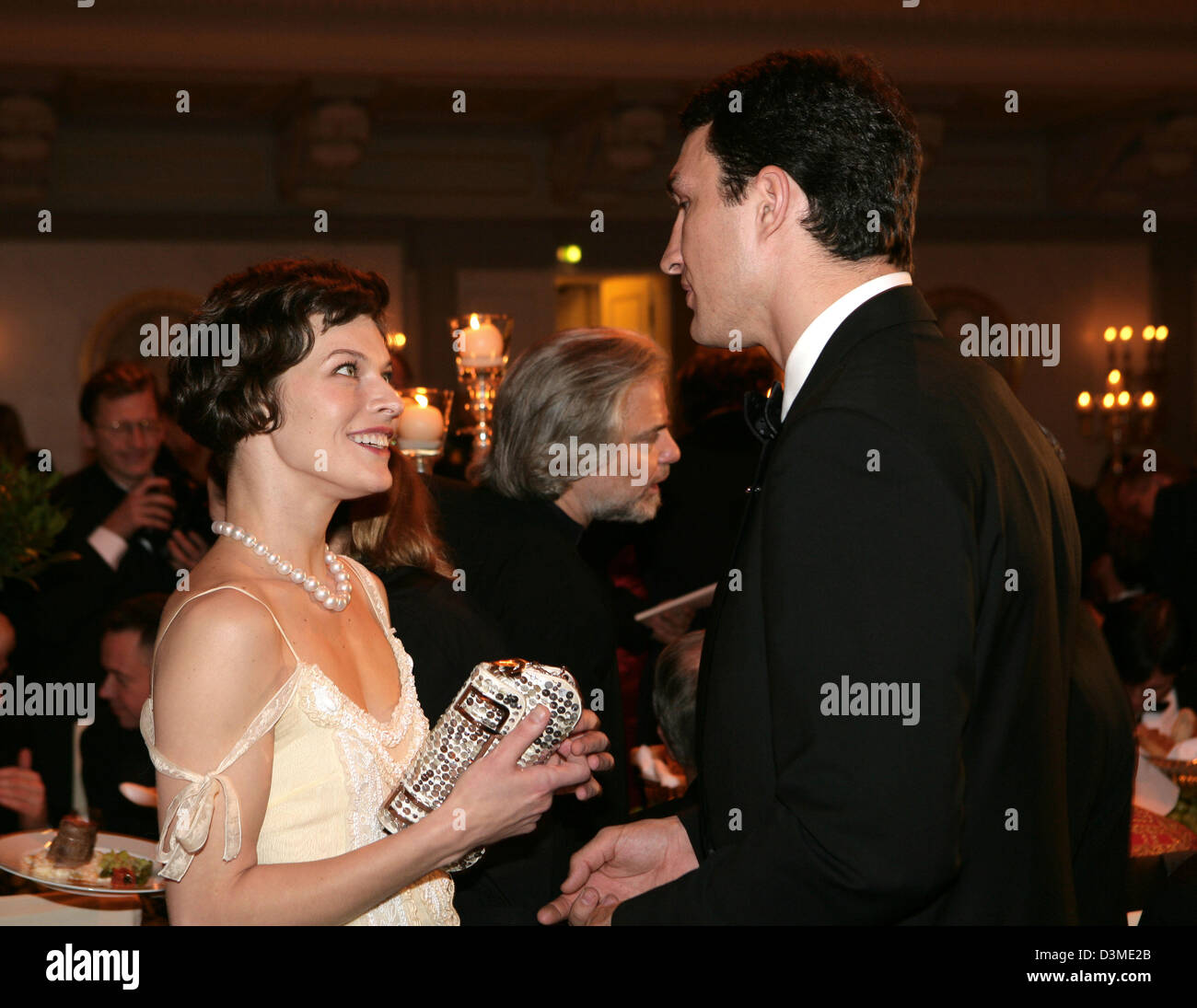 Ukranian actress and model Milla Jovovich chats with former pro boxer ...