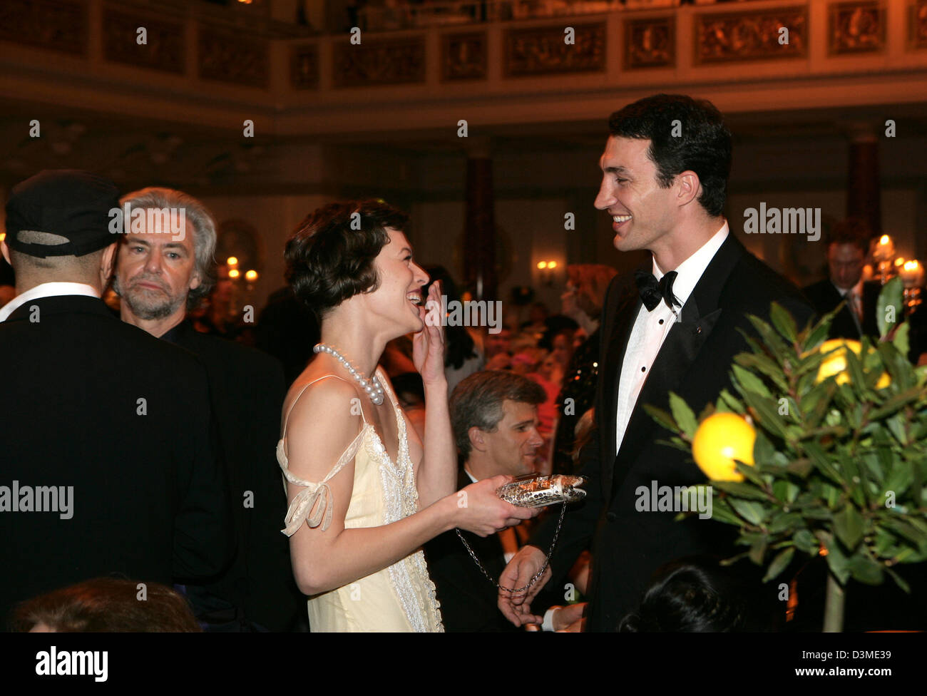 Ukranian actress and model Milla Jovovich chats with former pro boxer ...