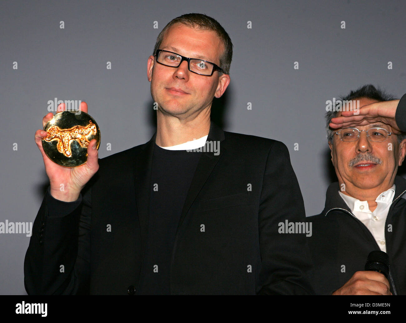 Swedish director Jonas Odell (L) proudly presents his 'Golden Bear ...