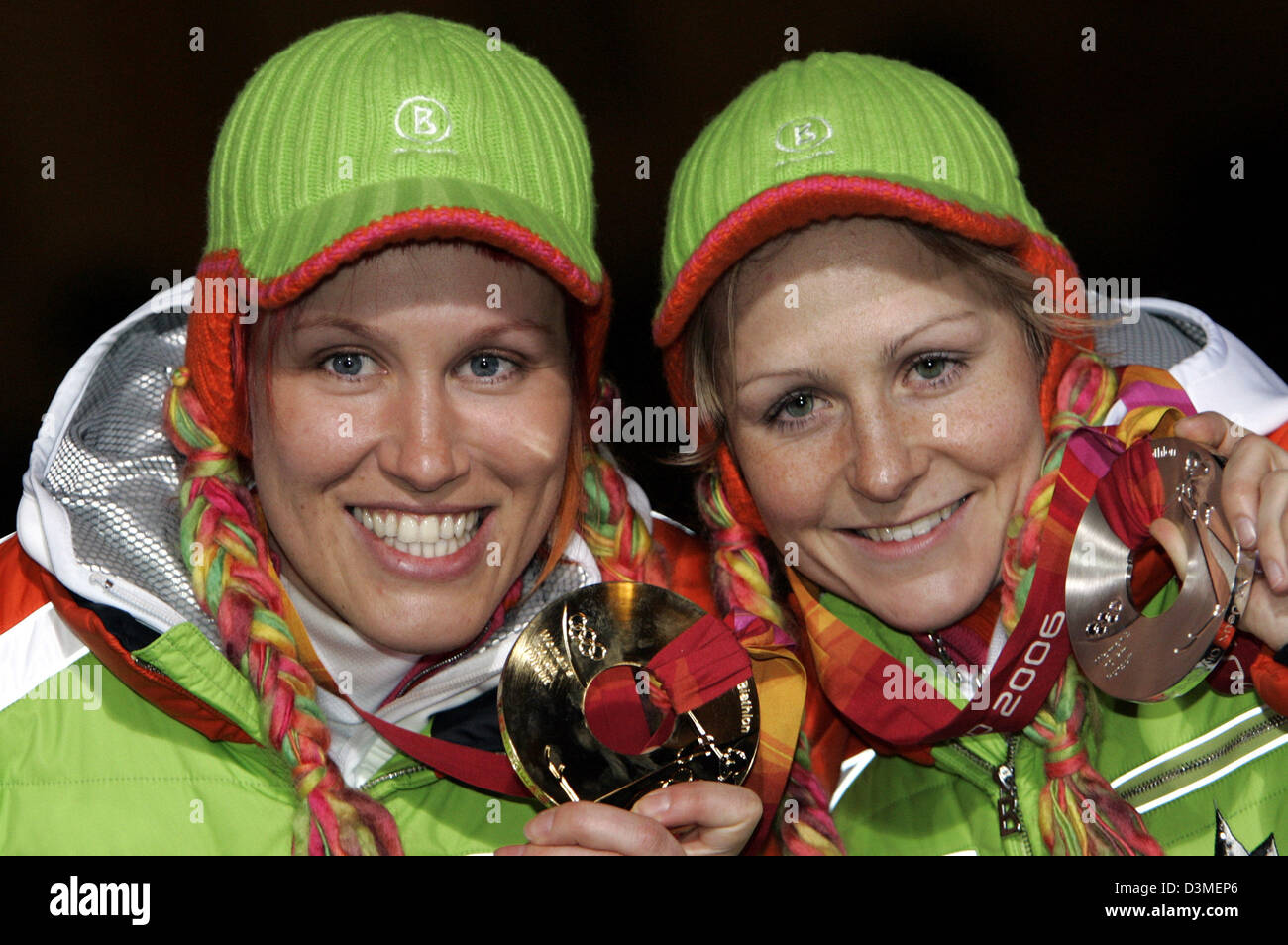 German biathletes Kati Wilhelm (L) and Martina Glagow show their medals ...