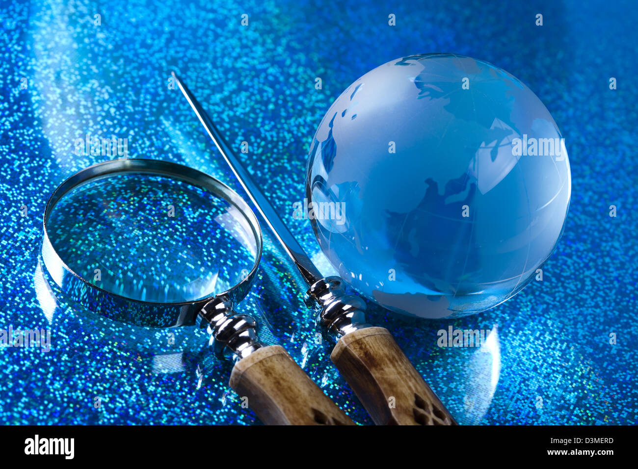 Globe and Magnifying glass Stock Photo - Alamy