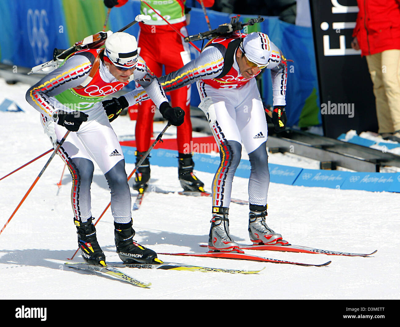 German biathletes start runner Ricco Gross (R) relays to Michael Roesch ...