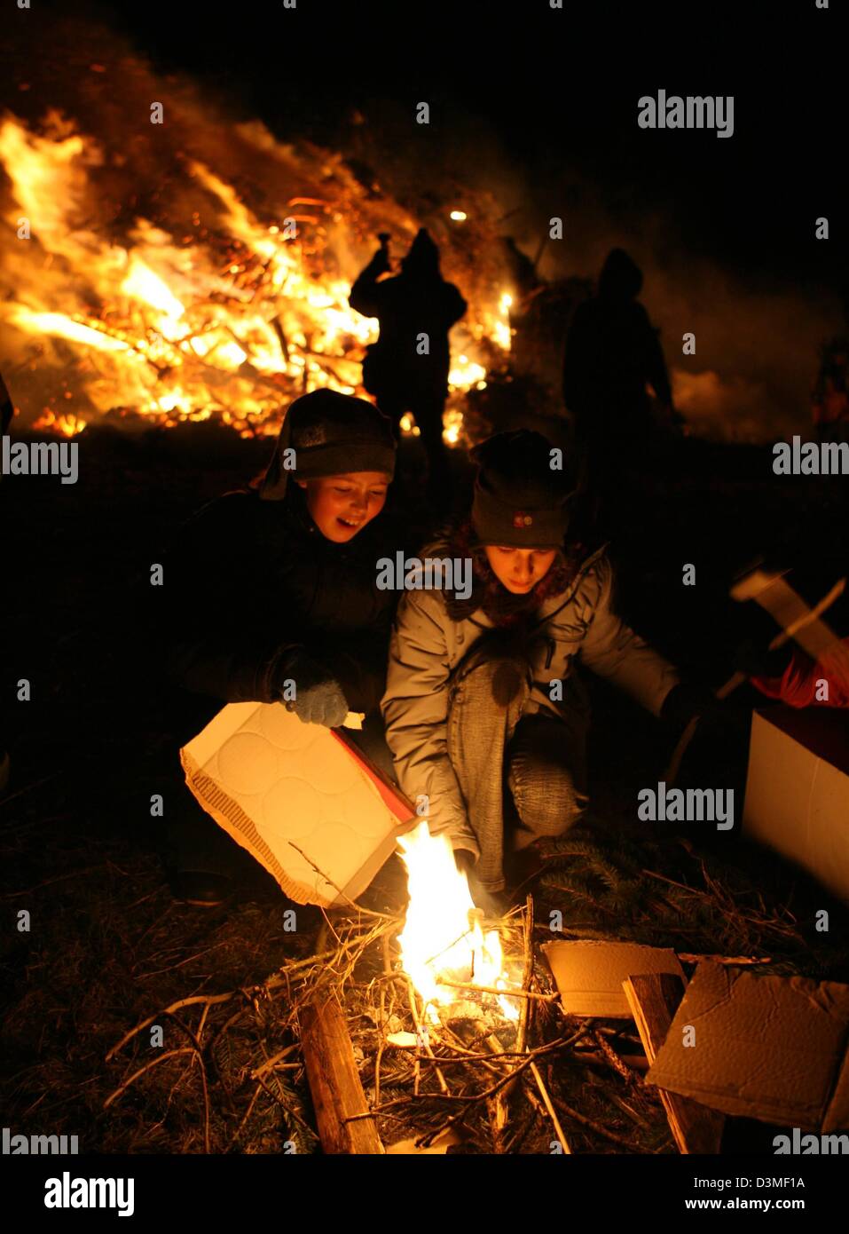 Two girls stage their own little pyre burning during the traditional ...