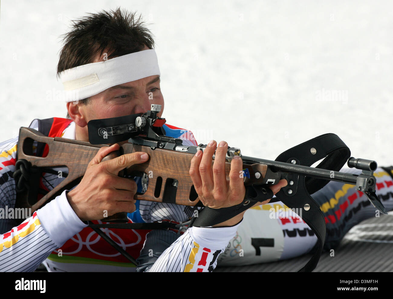 German biathlete Sven Fischer looks across his rifle at the shooting ...