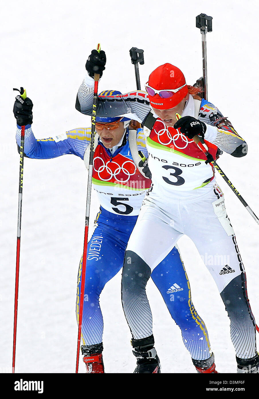 German biathlete Kati Wilhelm (L) and Carin Olofsson from Sweden skate ...