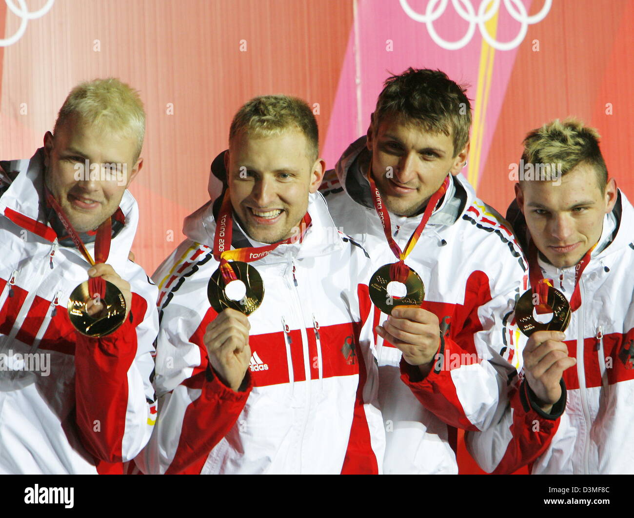 (dpa) - The German four-man bobsleigh team with pilot Andre Lange (L-R ...