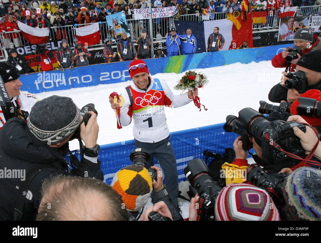 German biathlete Michael Greis poses with his gold medal after his ...