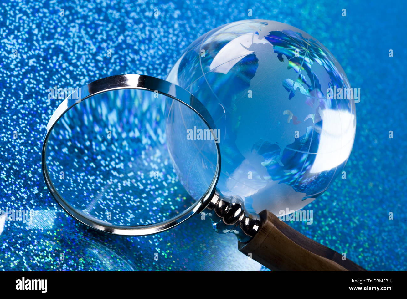 Globe and Magnifying glass Stock Photo - Alamy