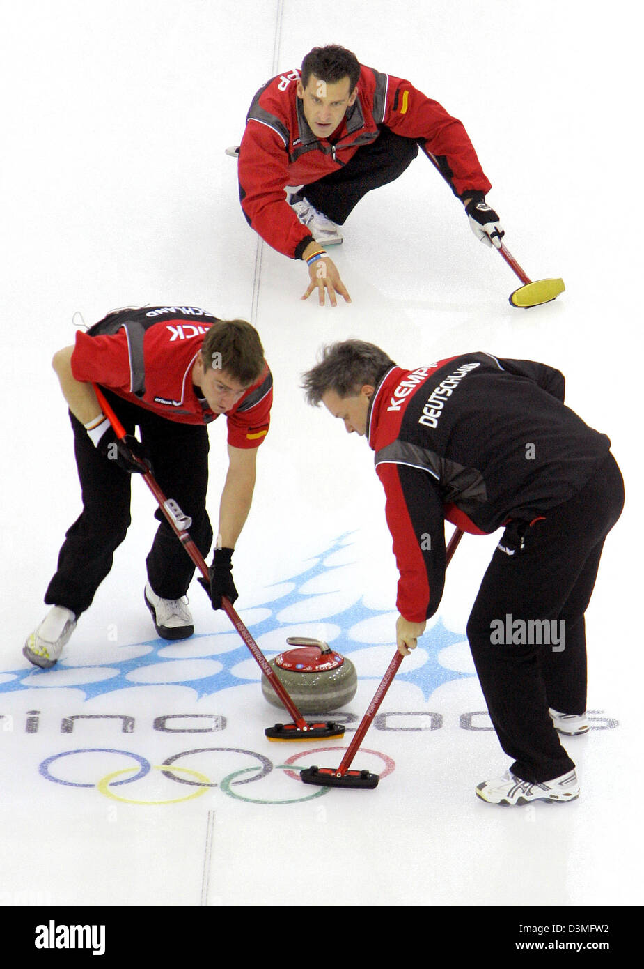 The German curling team (L-R) Oliver Axnick, Uli Kapp and Andreas Kempf ...