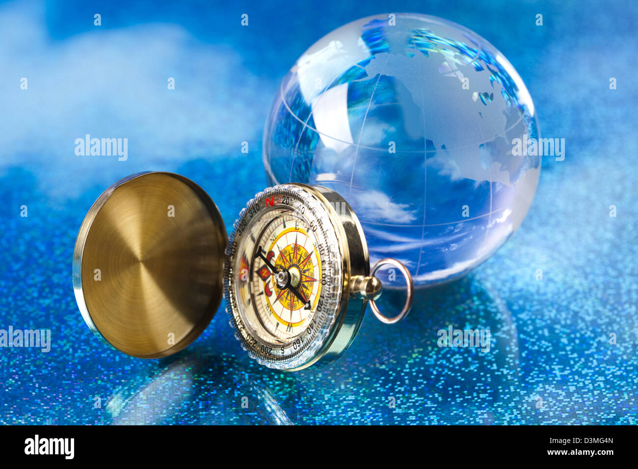 Magnifying glass, Compass and globe Stock Photo - Alamy
