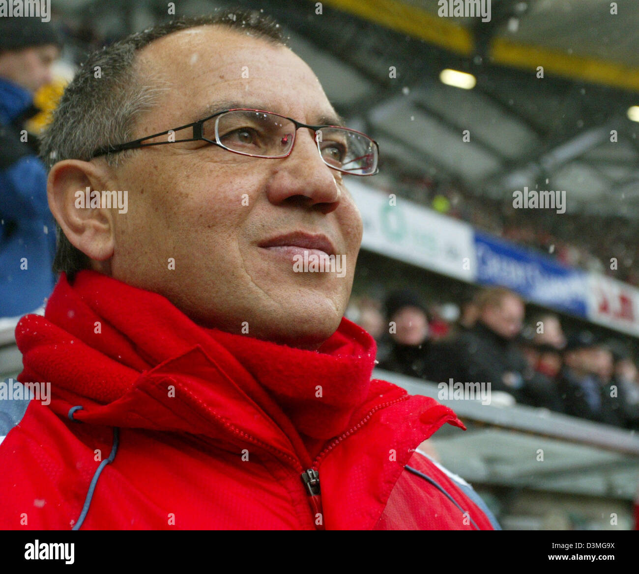 (dpa) - Munich coach Felix Magath looks towards the soccer field prior ...