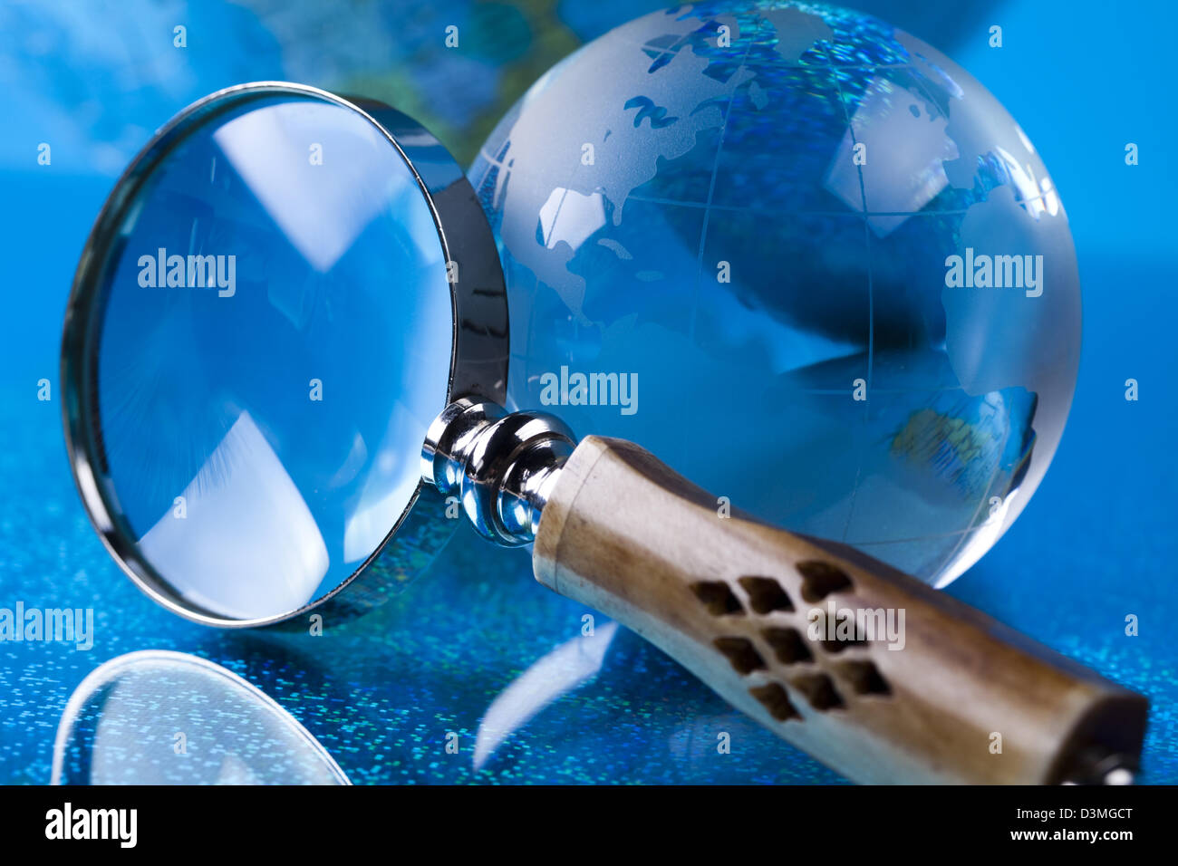 Globe and Magnifying glass Stock Photo - Alamy