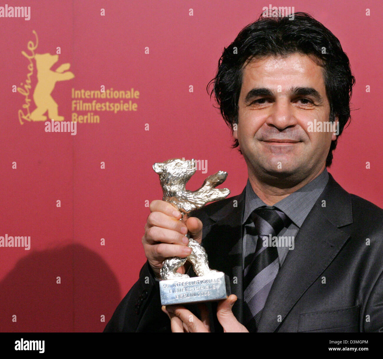 Iraqi director Jafar Panahi shows his silver bear that he was awarded ...