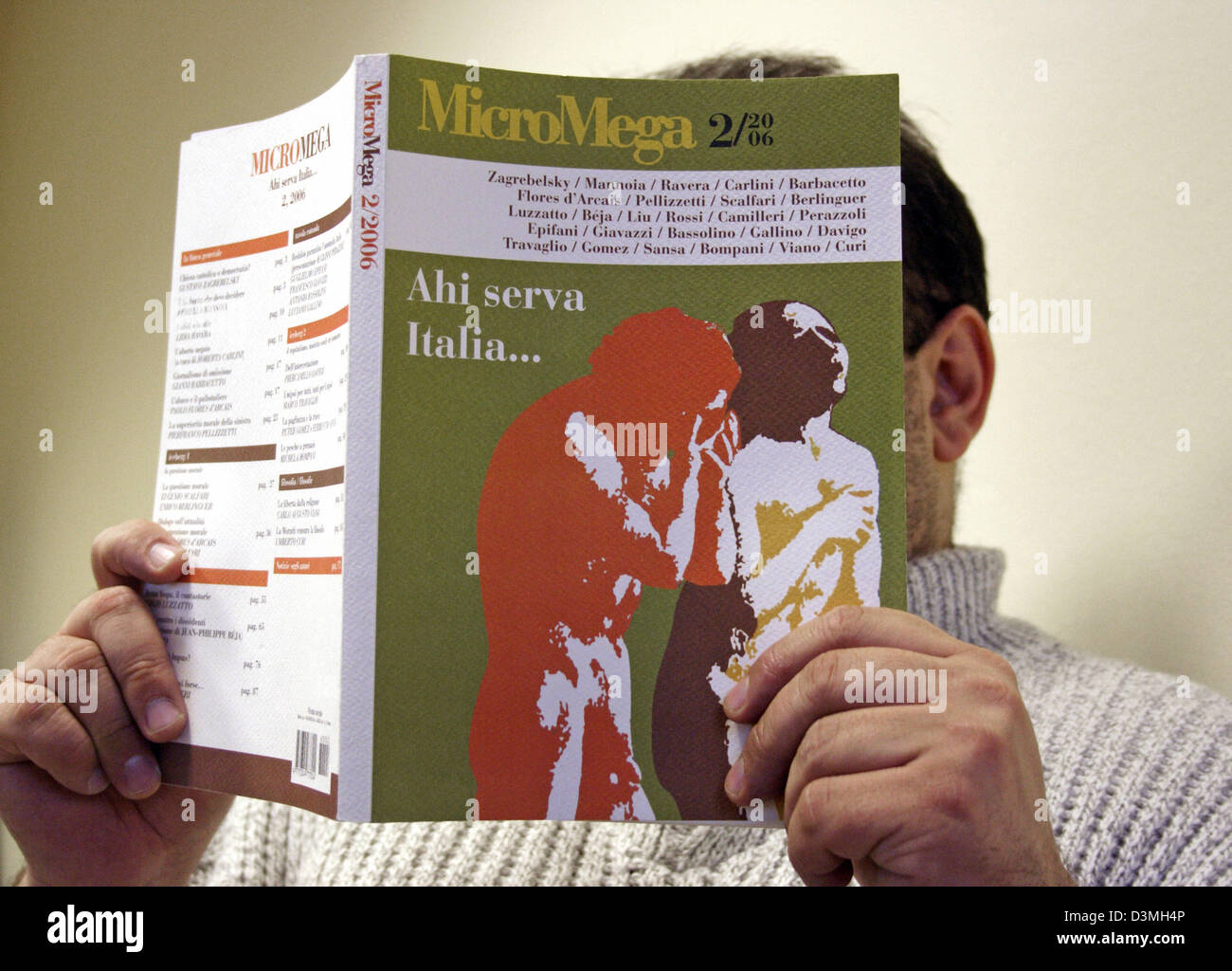 A man reads in the February edition of the Italian political and ...