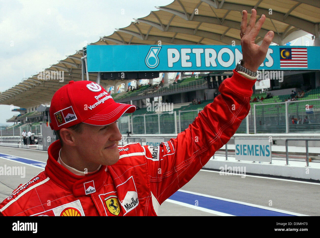 German Formula One driver Michael Schumacher of Ferrari's F1 team waves ...