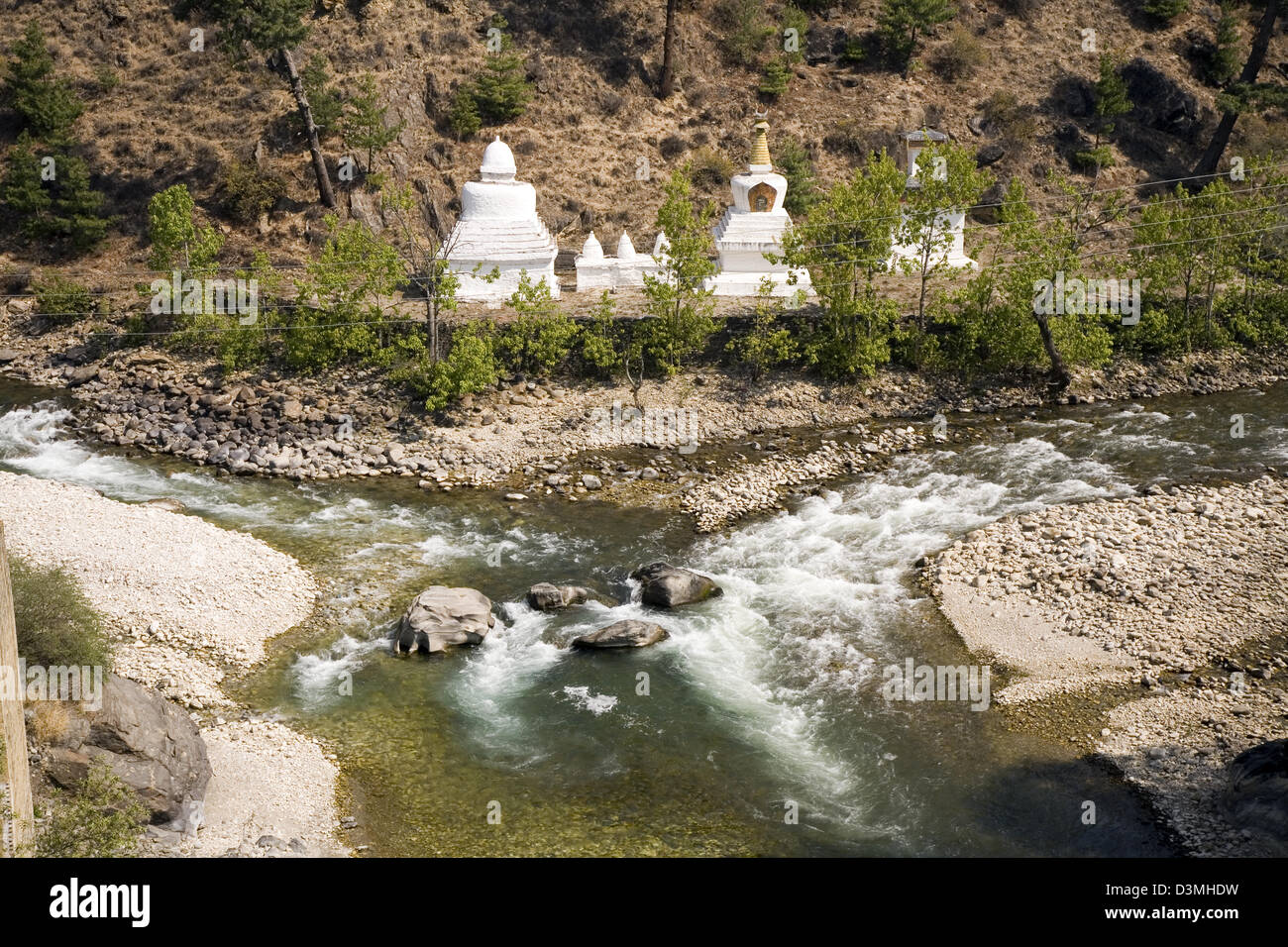 Three chortens stand at the confluence of the Paro Chhu and Wang Chhu ...