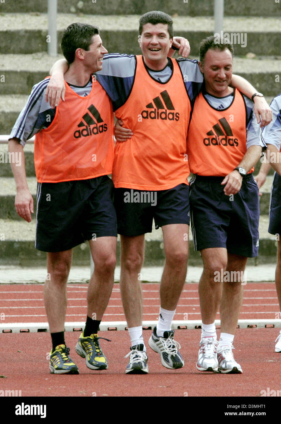 (L-R) The two German referees Markus Merk and Herbert Fandel and ...