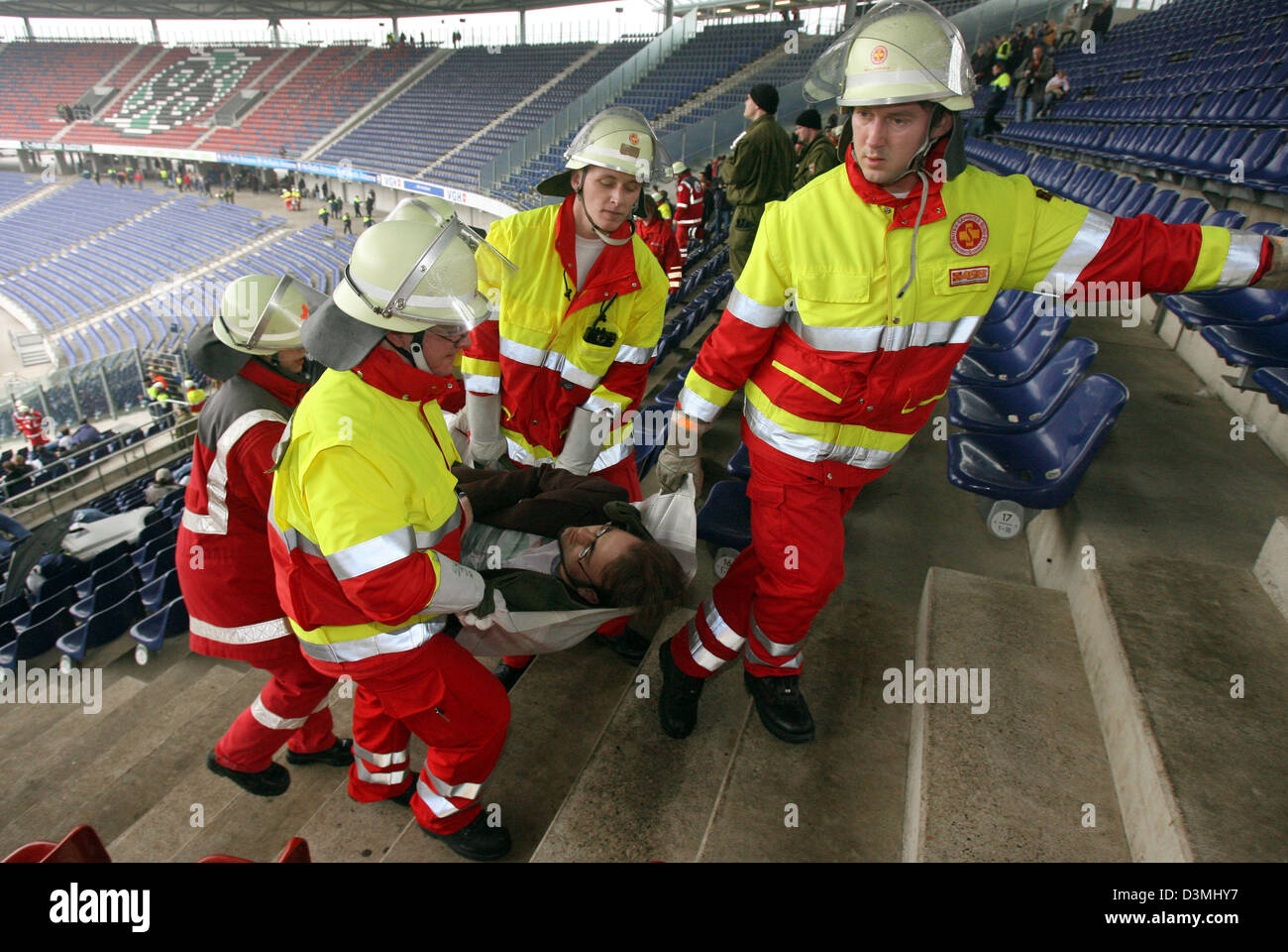 Paramedics and rescue services staff provide medical attention to ...