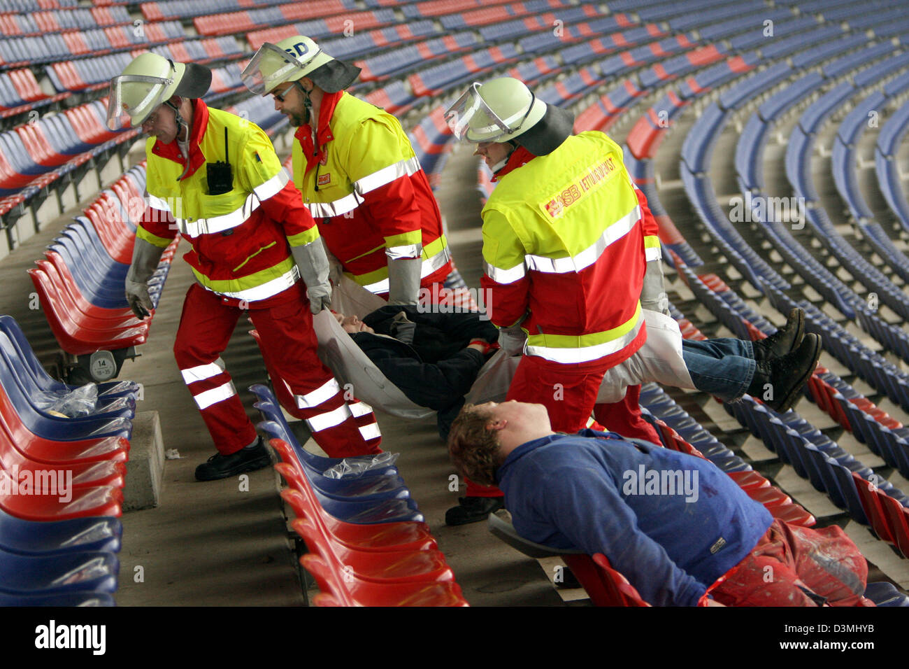 Paramedics and rescue services staff provide medical attention to ...