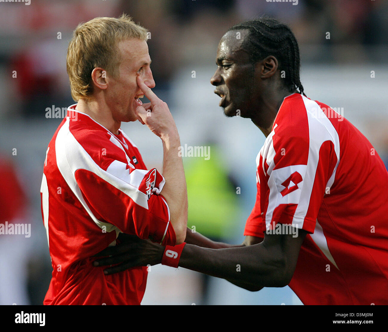 Mainz player Michael Thurk (L) celebrates and gestures to his teammate ...
