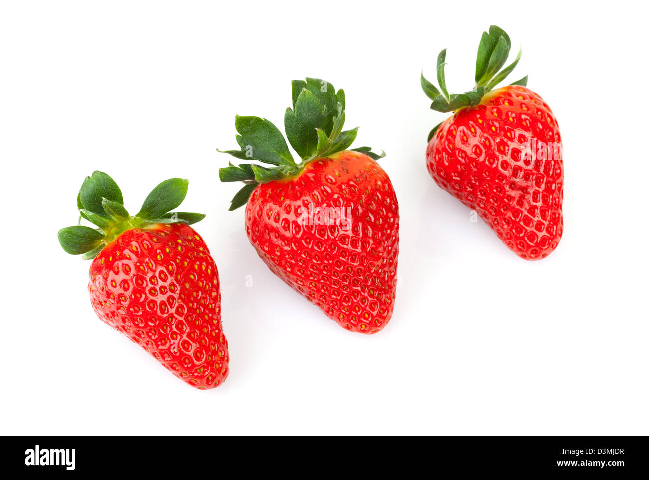 Group of bright red shiny strawberries hi-res stock photography and ...