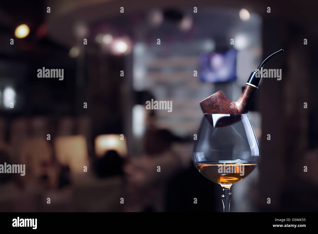 cognac and pipe on a dark background Stock Photo - Alamy